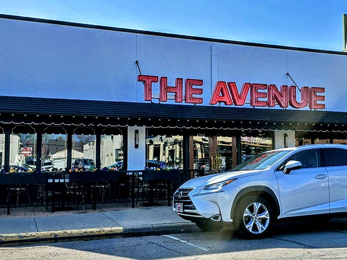 The Avenue's iconic red signage against crisp white walls isn't just a restaurant front—it's a beacon for carnivores with discerning taste buds.