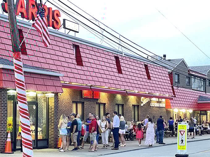 The iconic red-shingled roof of Sarris Candies beckons like a lighthouse for sweet-toothed travelers, with a cheerful storefront that invites visitors inside for a world of chocolate delights.