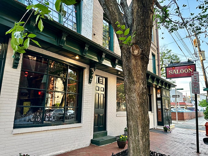 The Saloon's classic white brick exterior with its distinctive green trim feels like stepping into Philadelphia's storied past, where culinary treasures await behind that unassuming door.