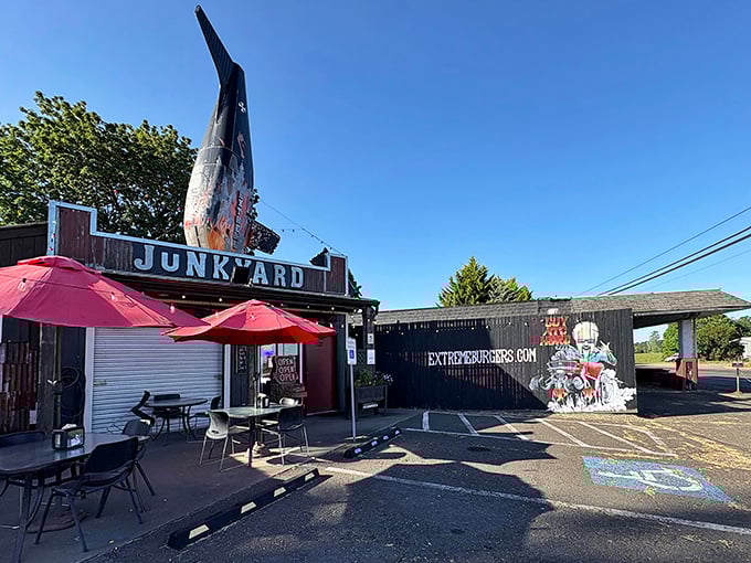 The airplane tail fin jutting from the roof isn't just decoration – it's your first clue that Junkyard's burgers will send your taste buds soaring.
