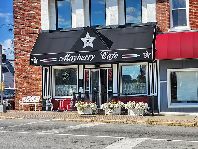 The iconic black awning with silver stars welcomes you to Mayberry Cafe, where nostalgic Americana meets small-town Indiana charm on Danville's courthouse square.