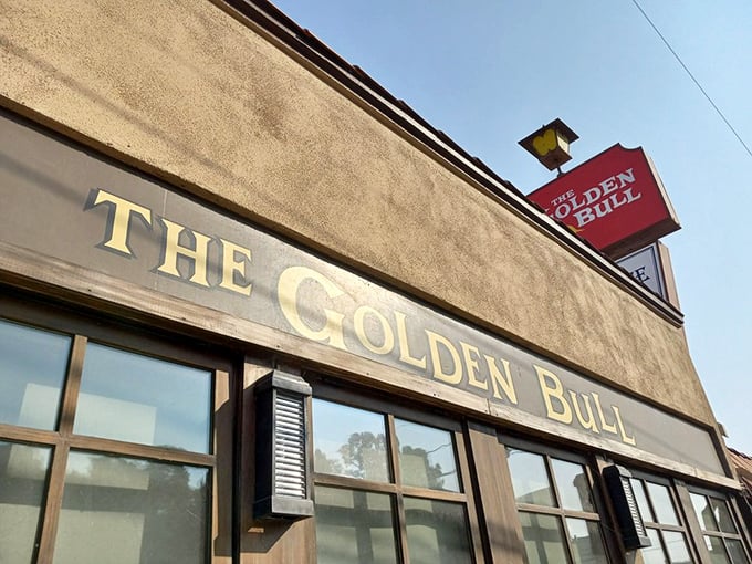 The iconic Golden Bull sign beckons like an old friend, promising comfort and satisfaction in equal measure.