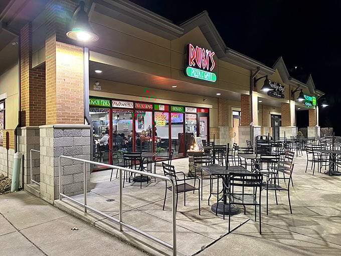 Rubi's neon sign glows like a beacon for hungry travelers, promising Italian comfort food in this unassuming strip mall location. Pizza paradise awaits.