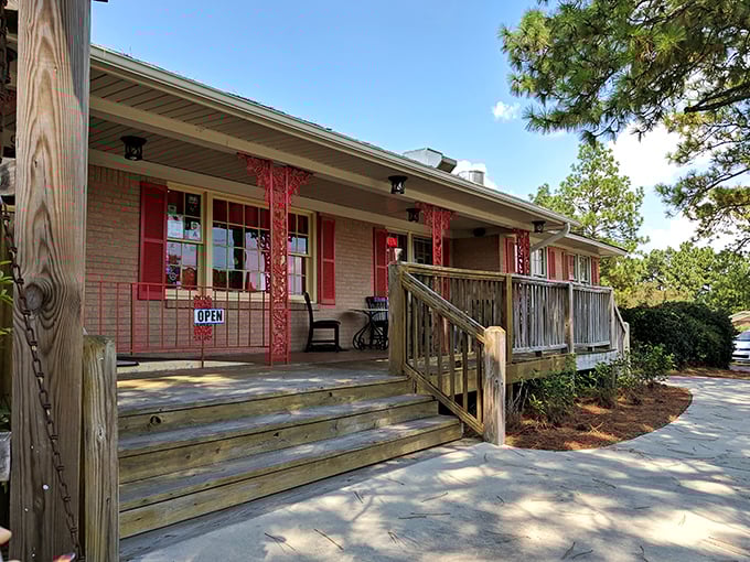 The welcoming wooden porch and bright red trim of Mama Henry's feels like a warm Southern hug before you even step inside.