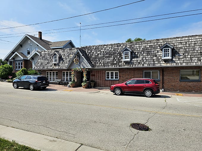 The shingled roof and brick exterior of Schwarz's Supper Club isn't trying to impress anyone—until you taste what's inside. Wisconsin's culinary treasures often hide in plain sight.