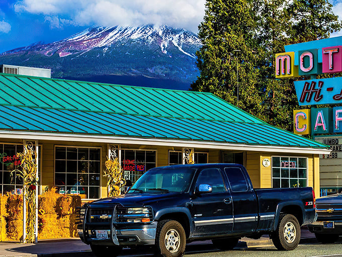 Mount Shasta stands guard over Hi-Lo Café like nature's own five-star review. The turquoise roof practically screams "comfort food ahead!"