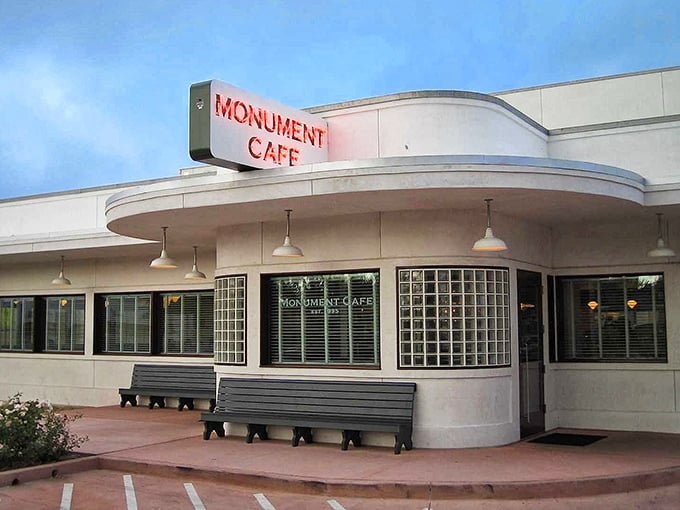 Art Deco dreams come alive at Monument Cafe's distinctive exterior. The curved white walls and bold red signage beckon hungry travelers like a culinary lighthouse in Georgetown.