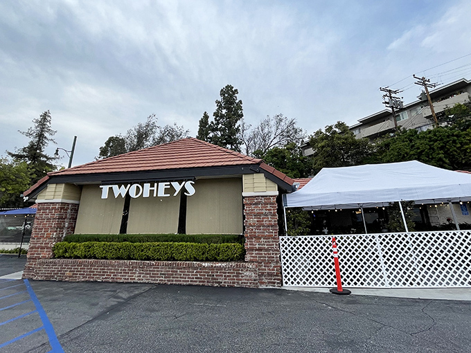 The iconic Twohey's exterior welcomes hungry patrons with its classic brick façade and mid-century charm – a culinary time machine waiting to transport you.