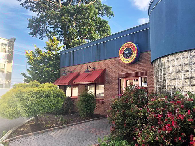 Those red awnings and vibrant landscaping aren't just for show—they're your first clue that flavor lives here.