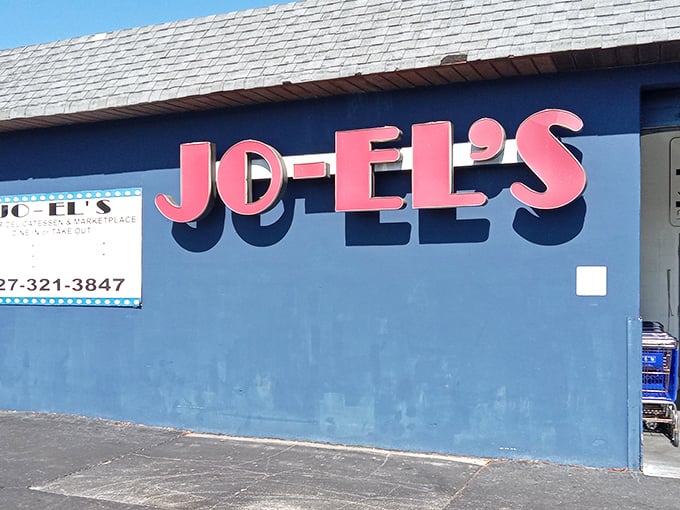 That pink-on-blue sign practically winks at you from the street – Florida's most colorful kosher secret.