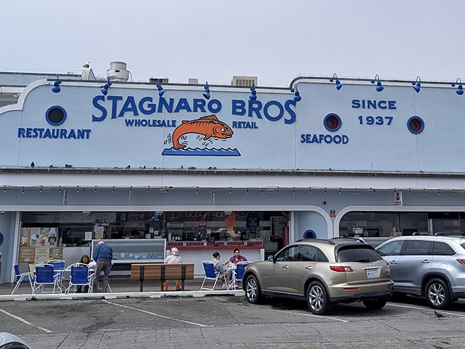 That sign has been welcoming hungry souls since before your favorite TV show existed – pure wharf magic.