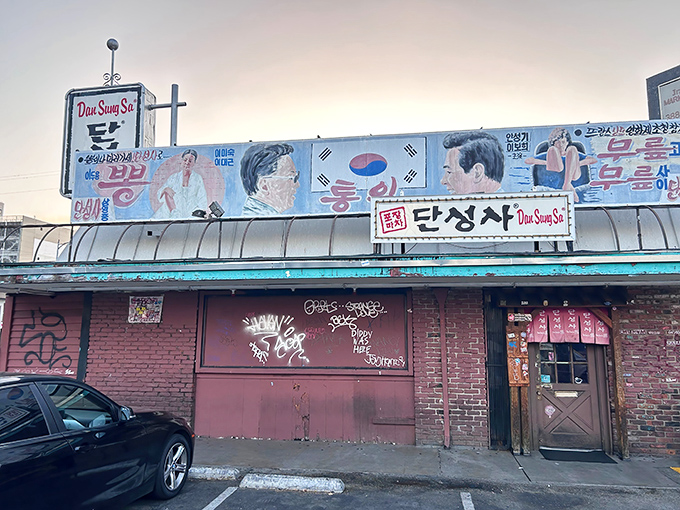 The unassuming exterior of Dan Sung Sa might not scream "culinary adventure," but that weathered brick facade hides a portal to authentic Korean flavors.