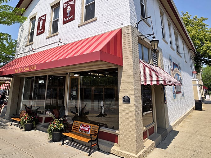 The iconic red awning of Big Ed's beckons like a time portal to simpler days when calories didn't count and root beer floats were considered essential nutrition.