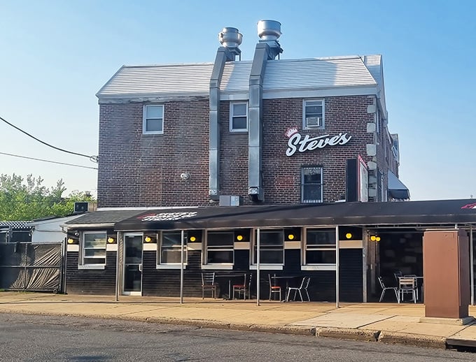 Morning light bathes the iconic Steve's facade, where the promise of cheesesteak perfection has drawn hungry Philadelphians for decades.