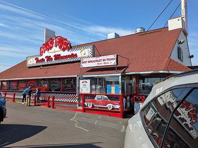 The classic red and white exterior of Nifty Fifty's stands like a beacon of nostalgia, promising comfort food that'll make your cardiologist wince and your taste buds sing.
