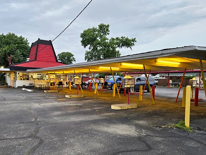 The iconic red roof of Cranwill's beckons like a lighthouse for hungry travelers. Those yellow and red posts aren't just supporting the structure—they're holding up decades of delicious memories.
