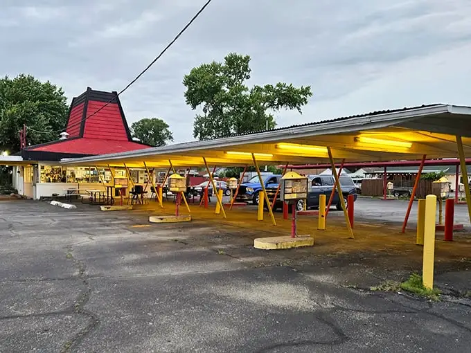 The iconic red roof of Cranwill's beckons like a lighthouse for hungry travelers. Those yellow and red posts aren't just supporting the structure—they're holding up decades of delicious memories.