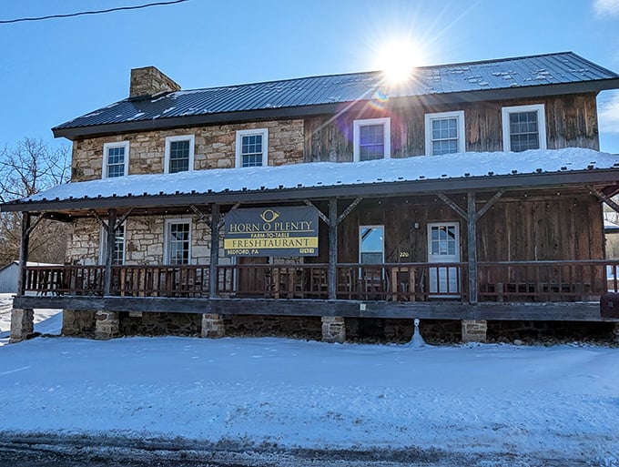 Winter transforms this Bedford gem into a snow-dusted postcard, the warm glow from within beckoning hungry travelers like a gastronomic lighthouse.