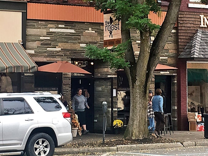 The Roost's charming storefront beckons from Wellsboro's historic Main Street, promising culinary adventures behind that unassuming stone façade.