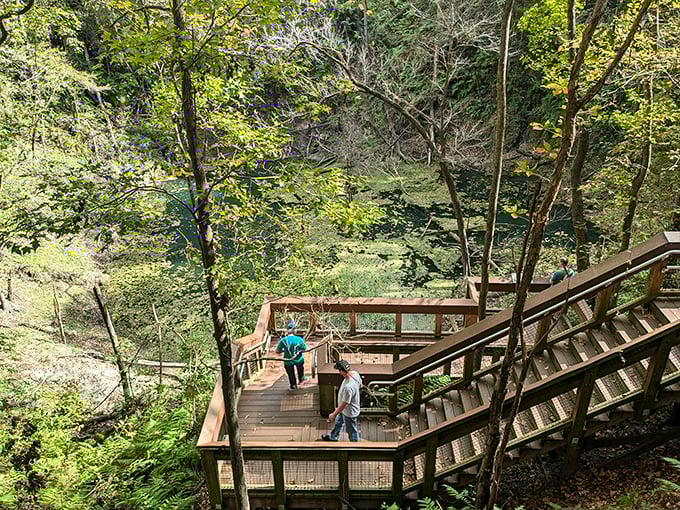 Visitors explore one of the landings along the 232-step journey. Each stop offers a new perspective on this geological wonder—and a chance to catch your breath!