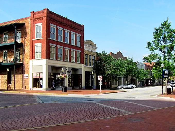 Historic brick buildings line Spartanburg's downtown streets, where modern businesses thrive in spaces that have witnessed over a century of Southern stories.