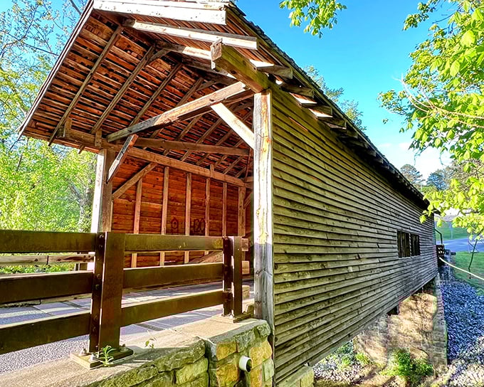 The weathered wooden exterior tells stories without saying a word, its planks and beams standing as silent witnesses to generations of Tennessee travelers.