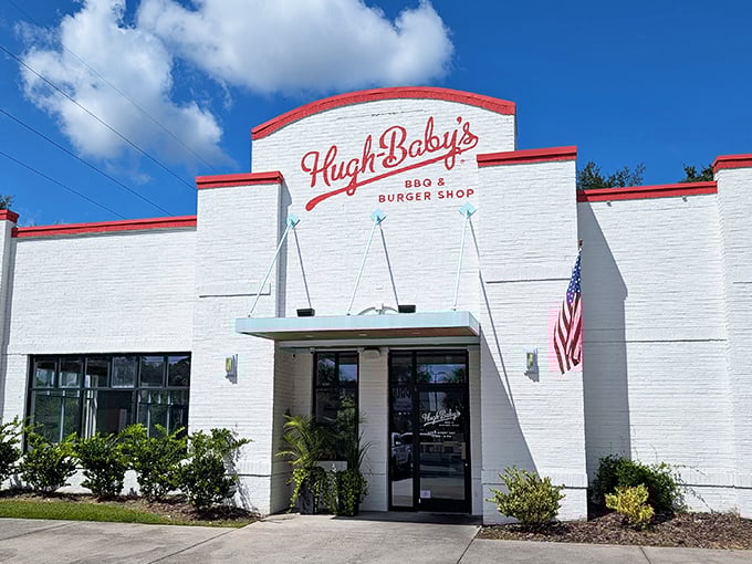 The white brick exterior with that bold red trim isn't just eye-catching—it's a promise of the no-nonsense deliciousness waiting inside this Charleston gem.