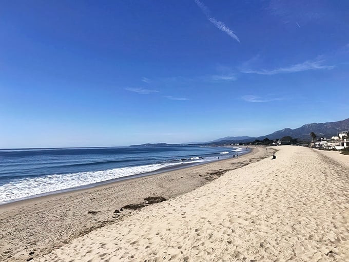 Wide stretches of golden sand meet endless blue horizons in this pristine coastal paradise.