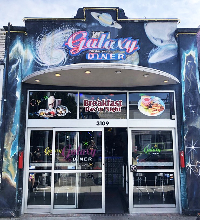That cosmic exterior mural isn't just decoration – it's a promise of stellar comfort food waiting inside.