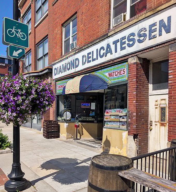 The brick facade of Diamond Deli stands proudly on Akron's South Main Street, its vintage sign and blue awning like a beacon for sandwich enthusiasts seeking culinary salvation.