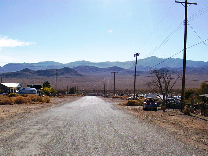 Welcome to Darwin, where the road sign might be the most populated spot in town. Those mountains aren't just scenery—they're neighbors.
