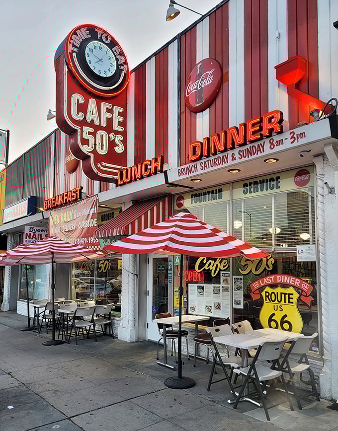 The neon-lit facade of Cafe 50's glows like a beacon for hungry time travelers on Santa Monica Boulevard. It's not just a sign—it's a promise.