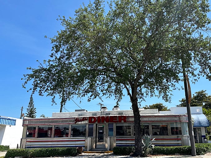 The classic American diner silhouette against Florida's blue sky – where breakfast dreams come true and calories don't count until tomorrow.
