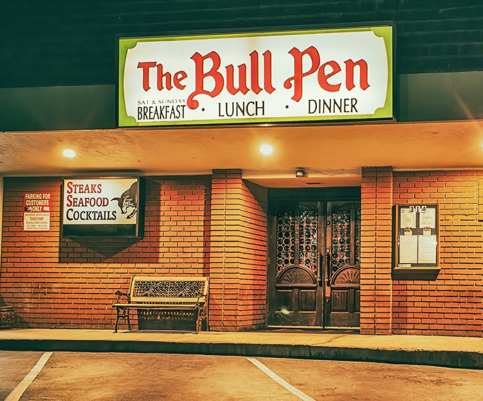 The unassuming strip mall exterior of The Bull Pen hides a culinary time capsule within. Classic steakhouse magic doesn't always wear a fancy facade.