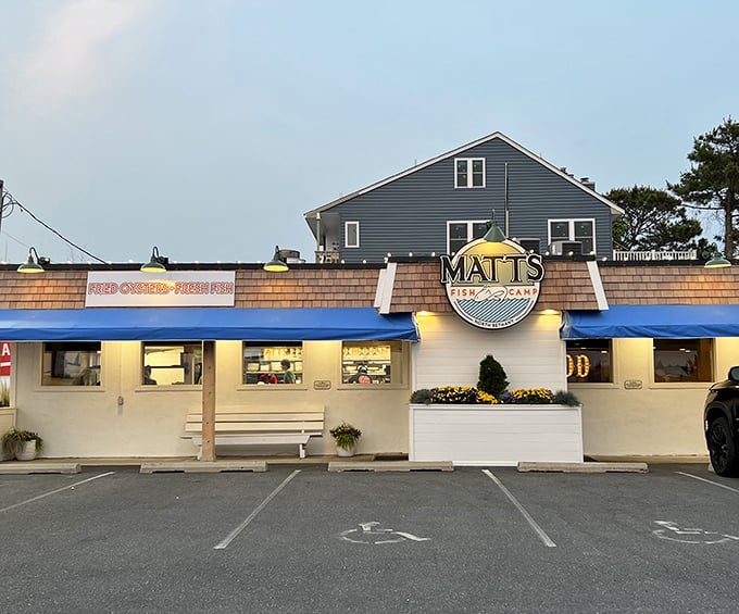 The unassuming blue-awninged exterior of Matt's Fish Camp proves once again that coastal Delaware's best seafood treasures often hide in plain sight.
