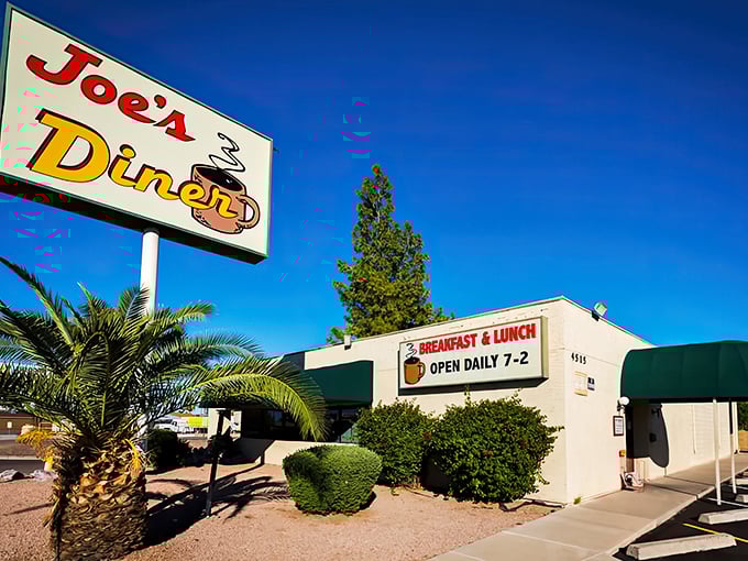 The sunshine-yellow exterior of Joe's Diner stands out against Phoenix's blue sky like a beacon for breakfast enthusiasts seeking refuge from trendy brunch spots.