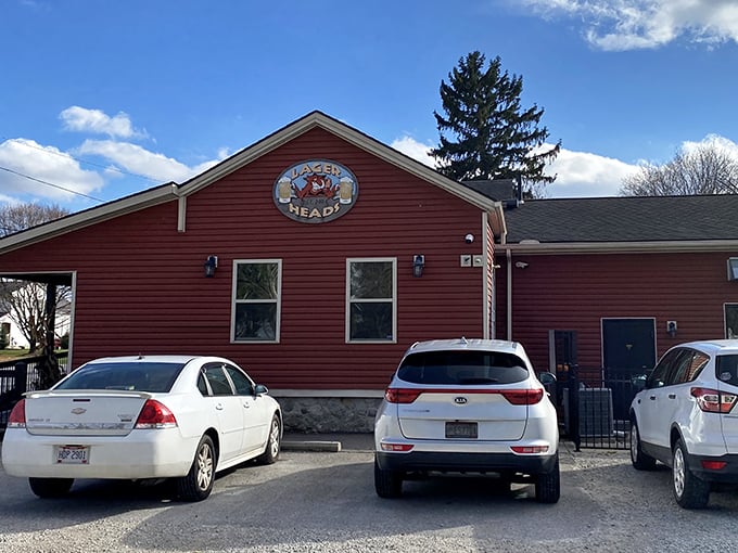 The rustic red exterior of Lager Heads stands like a beacon for BBQ pilgrims. This unassuming building houses smoky treasures worth crossing county lines for.