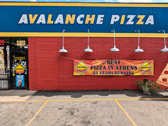 The blue and red exterior of Avalanche Pizza stands out like a superhero's costume – bold, unmistakable, and promising to save you from mediocre meals.