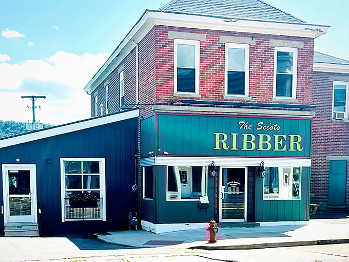The unassuming facade of Scioto Ribber stands proudly in Portsmouth, with the American flag fluttering like a promise that something delicious awaits inside.
