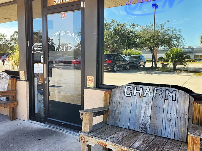 "CHARM" indeed – this weathered wooden bench outside speaks the truth about what awaits inside this Port Canaveral gem.