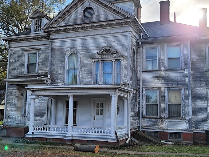 This isn't just another pretty facade – the Gill House's classical columns and detailed porch railings whisper stories of Gilded Age opulence.