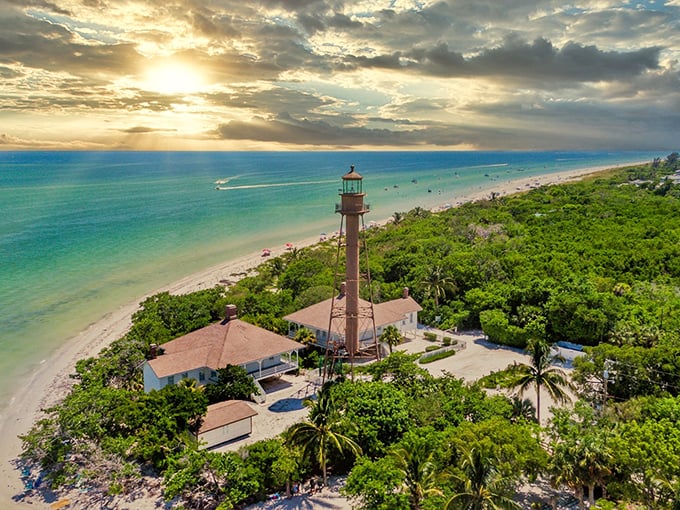 The historic Sanibel Lighthouse from above—where shell seekers and dolphin watchers have gathered since 1884. Florida's paradise, perfectly framed.