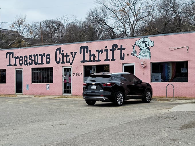 The bubblegum-pink exterior of Treasure City Thrift stands out like a flamingo in a penguin parade, beckoning bargain hunters with its vibrant charm.