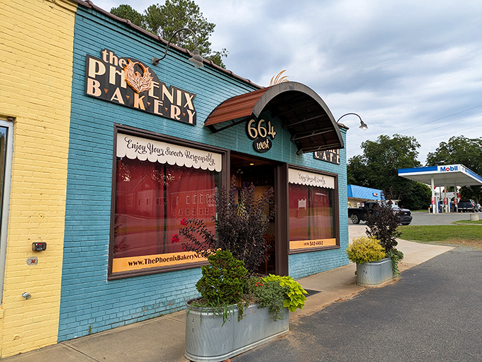 The Phoenix Bakery's teal and yellow exterior isn't just eye-catching—it's like a colorful promise of the sweet treasures waiting inside this Pittsboro gem.