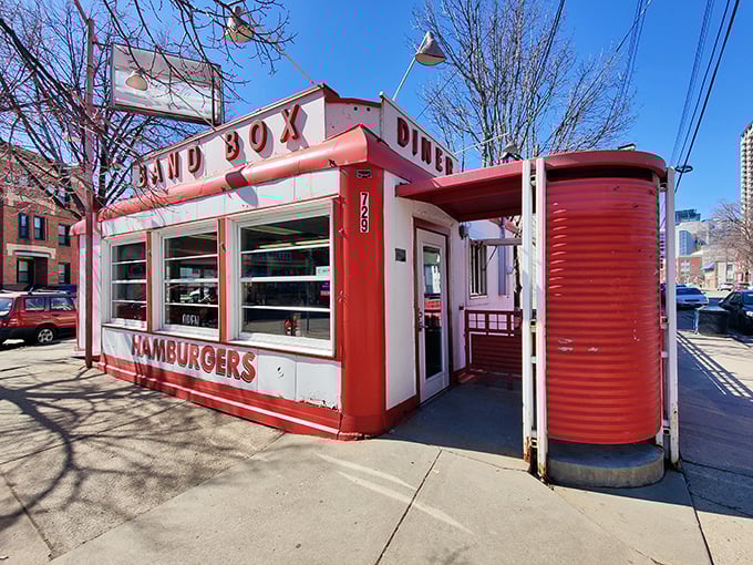 The iconic red-and-white exterior of Band Box Diner stands like a time capsule on the Minneapolis corner, promising nostalgic flavors and zero pretension.