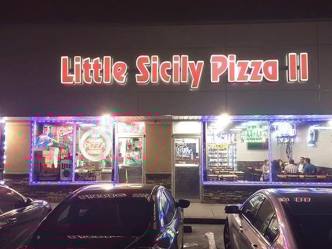 Little Sicily Pizza II glows like a beacon in the night, promising comfort food salvation for hungry Philadelphians seeking their cheesesteak fix.