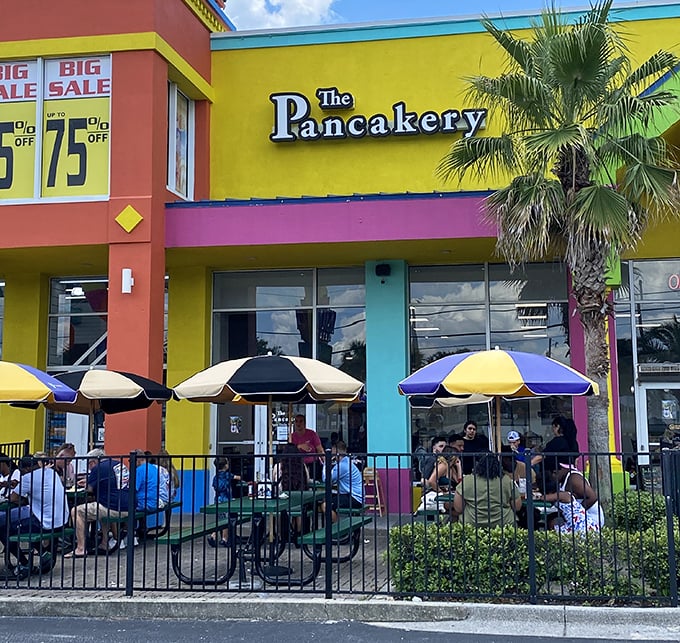 Like a tropical bird among seagulls, The Pancakery's vibrant facade and cheerful patio umbrellas stand out gloriously against Destin's typical beachside architecture.