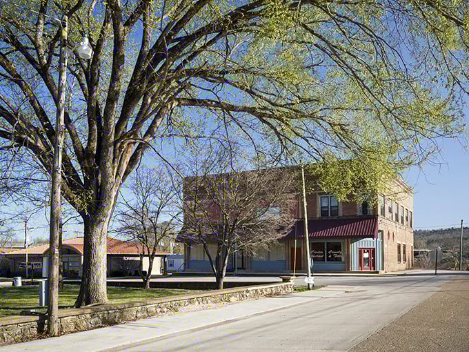 Downtown Van Buren greets visitors with classic small-town charm, where brick buildings and leafy trees create the perfect gateway to Ozark adventures.
