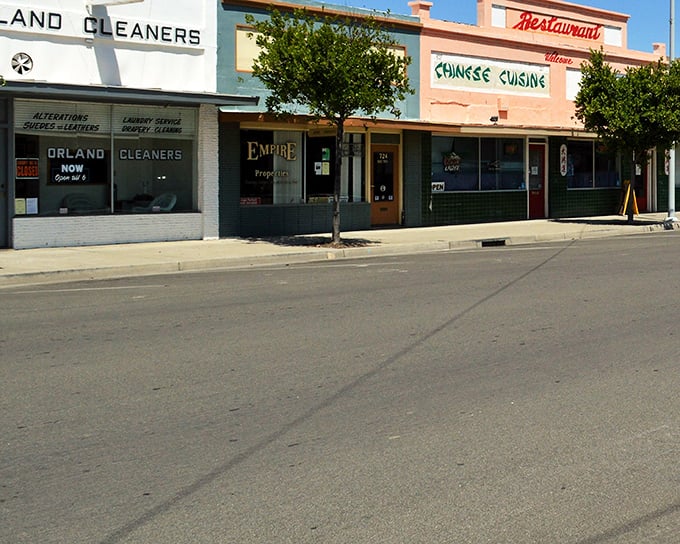 Downtown Orland's vintage storefronts tell stories of simpler times, where Orland Cleaners stands alongside the promise of Chinese cuisine – small-town charm personified. 