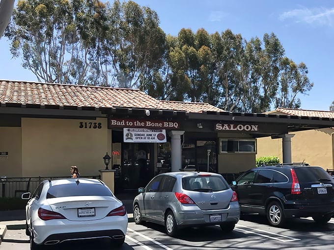 The unassuming exterior of Bad to the Bone BBQ belies the smoky treasures within. Mission-style architecture meets meat paradise in San Juan Capistrano.